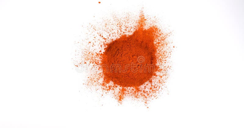 Paprika, Capsicum Annuum, Powder Exploding Against White Background ...
