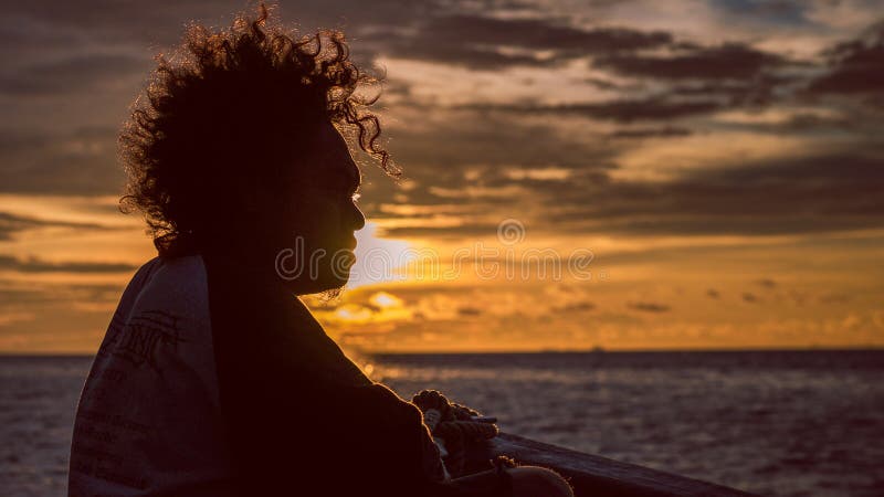 Papuans in Sunset Light on the Way To Kri Island. Raja Ampat, Indonesia ... Papuans in Sunset Light on the Way To Kri Island. Raja Ampat, Indonesia ...