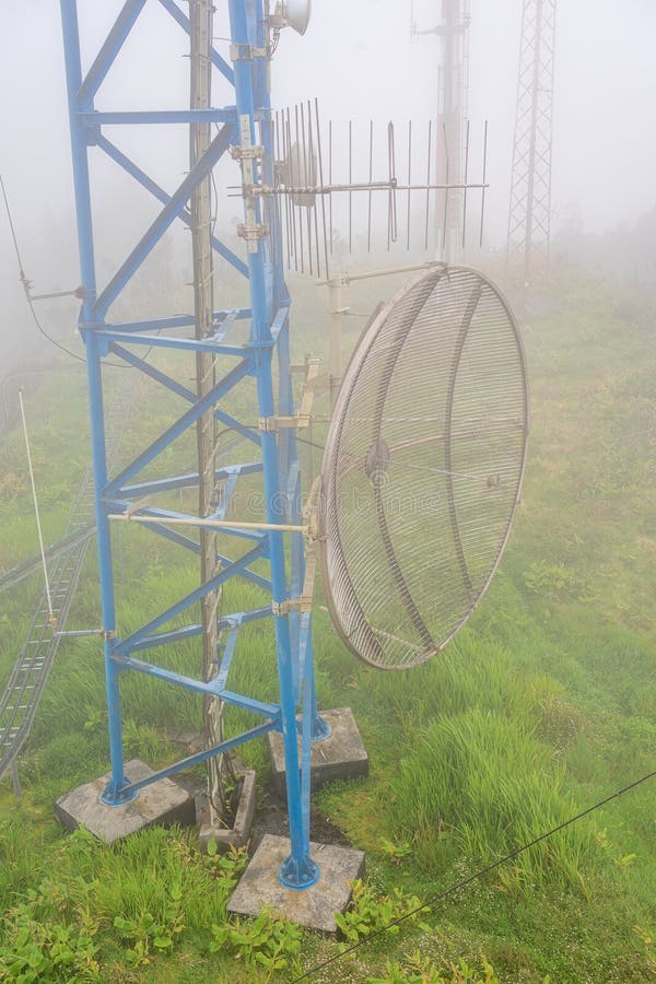 Parabolic and Directional Antenna Attached To a Blue Structure Tower ...