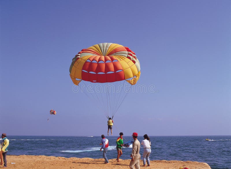 Parachute above Sea stock photo. Image of green, goggle - 943982
