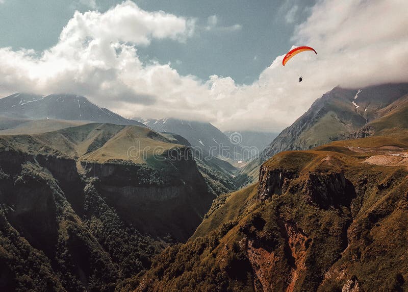 Parachute Flying Over Beautiful Mountains Stock Photo - Image of clouds ...