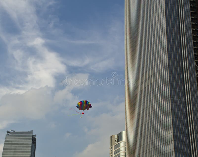 Parachute among the High Building. Stock Image - Image of childhood ...