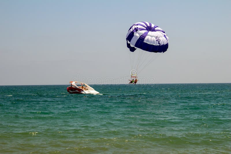 Parachute over the sea stock image. Image of color, skydive - 97410935