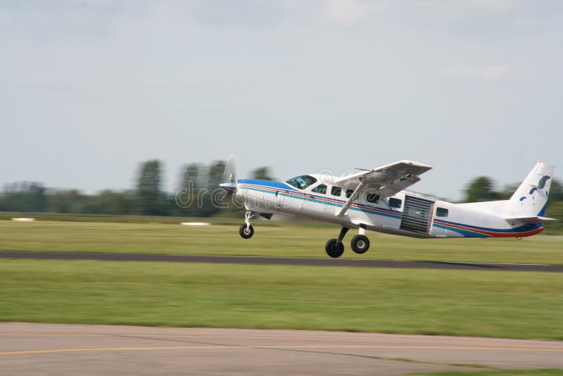 Parachute Plane stock image. Image of wind, green, cessna - 863023