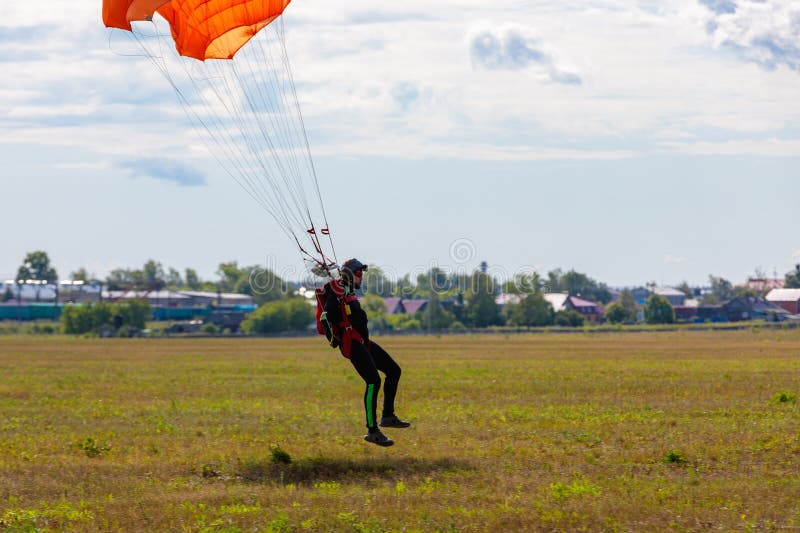 Parachute in the Sky. Skydiver is Flying a Parachute in the Blue Sky ...