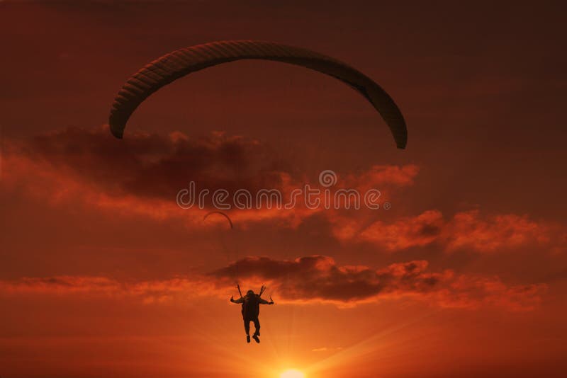 Parachute in the sunset. stock photo. Image of flight - 51321294