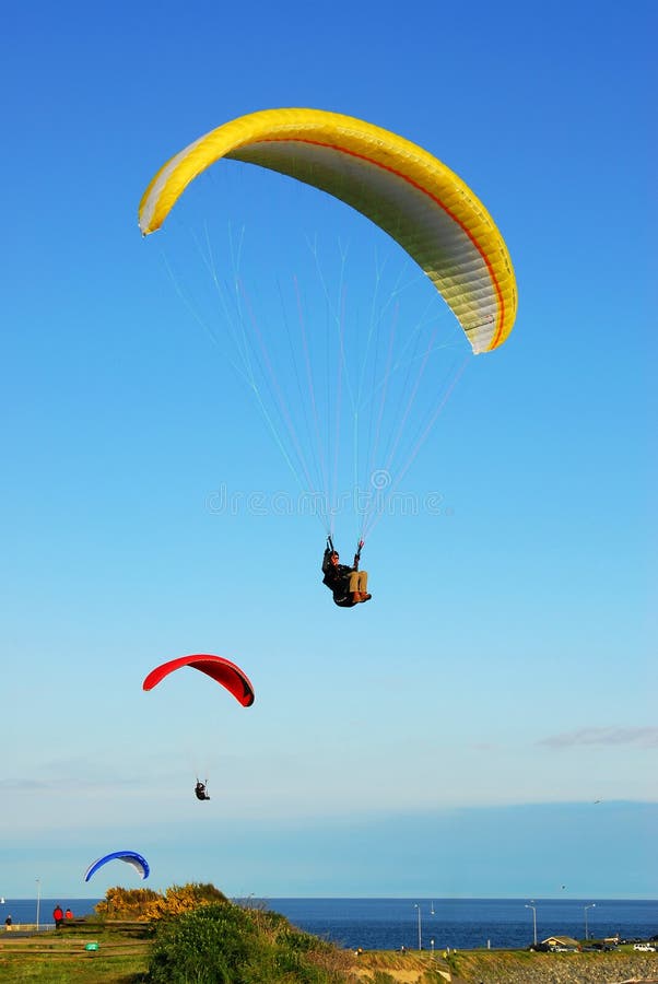 Parachutes Flying Above the Ocean Stock Photo - Image of dive, british ...
