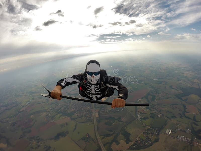 Parachutist Dressed for the Helloween in Free Fall. Skeleton Stock ...