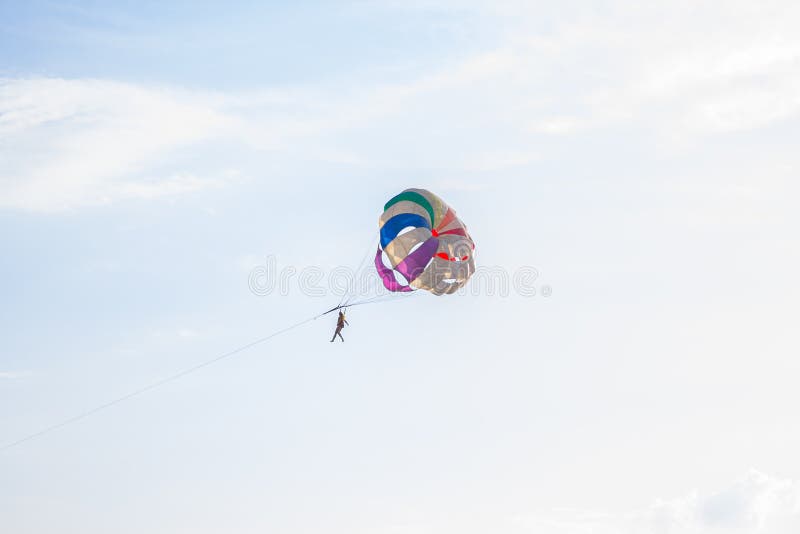 Parachutist Flying on Multi-colored Parachute Stock Image - Image of ...