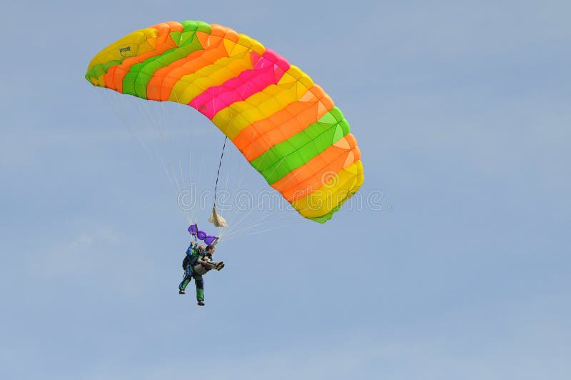 The Parachutist Goes Down on a Multi-colored Parachute. Editorial Image ...