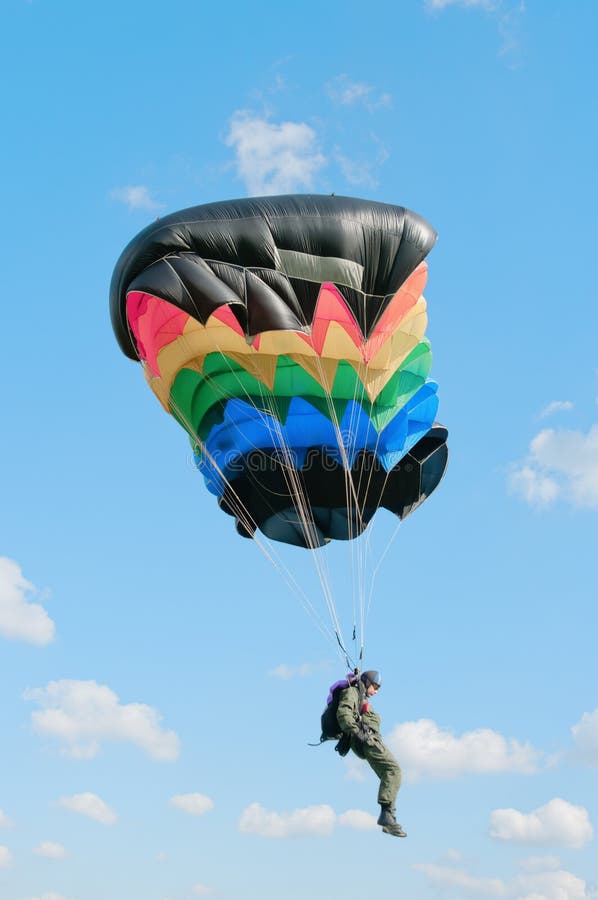 The Parachutist Under a Multi-colour Parachute Stock Photo - Image of ...