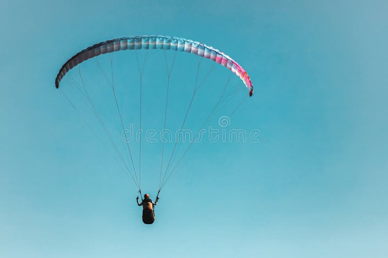 Paraglider in the Sky. the Sportsman Flying on a Paraglider. Stock ...