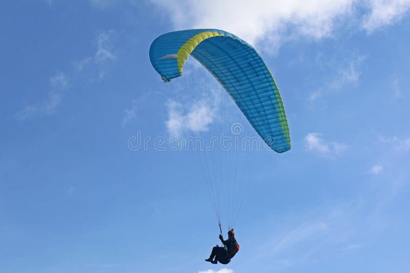 Paraglider Flying in a Blue Sky Stock Image - Image of skydiving ...