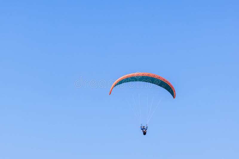 Paraglider Flying High Up at a Blue Sunny Sky Stock Photo - Image of ...