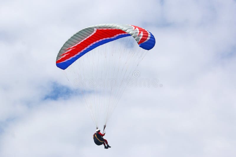 Paraglider flying red wing stock image. Image of paraglide - 143639763