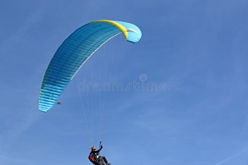 Paraglider Flying in a Blue Sky Stock Image - Image of flier, lines ...