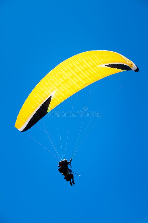 Paraglider Instructor Flying with Customer in Blue Summer Sky with Go ...