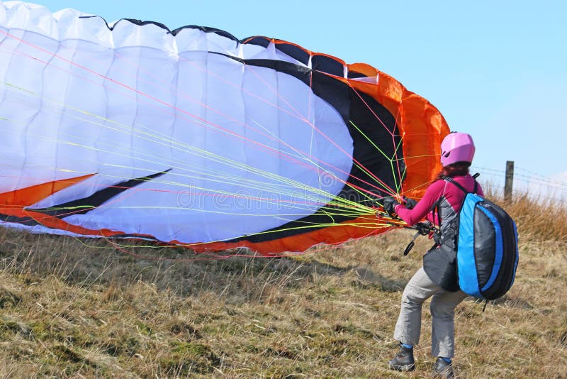 Paraglider launching stock image. Image of woman, ground - 87544415