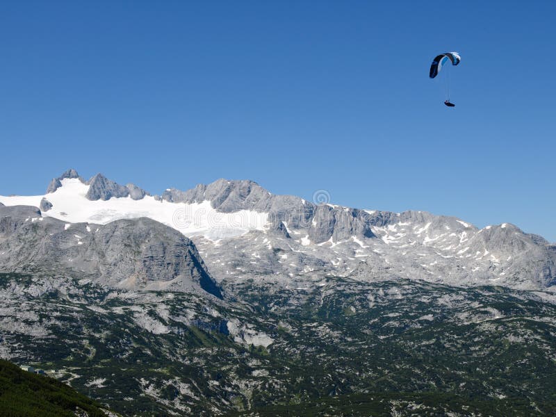 Paraglider over rocks stock photo. Image of parasailing - 35662672
