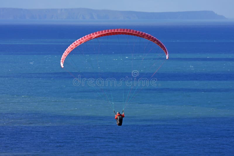 Paraglider over the sea stock image. Image of paraglide - 46692227
