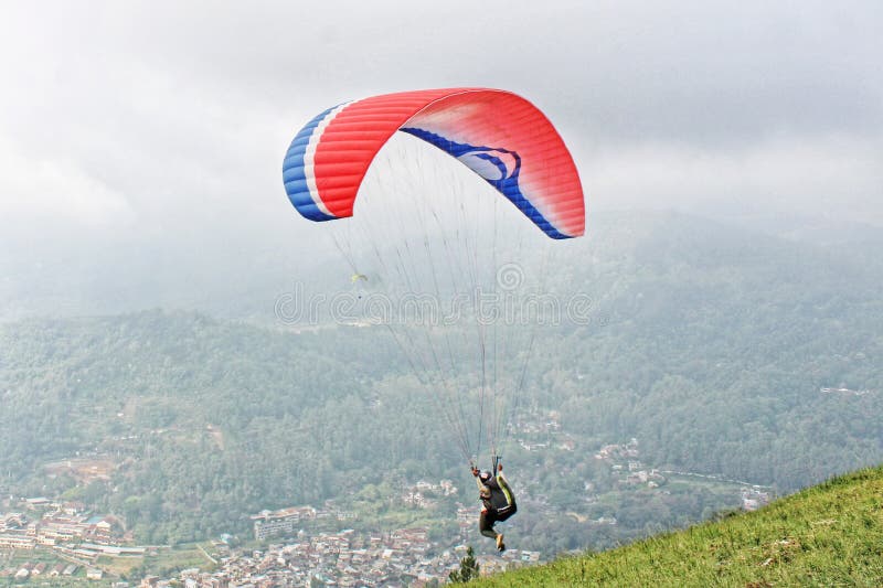 Paraglider Pilot Flying after Taking Off from a Hill Stock Image ...