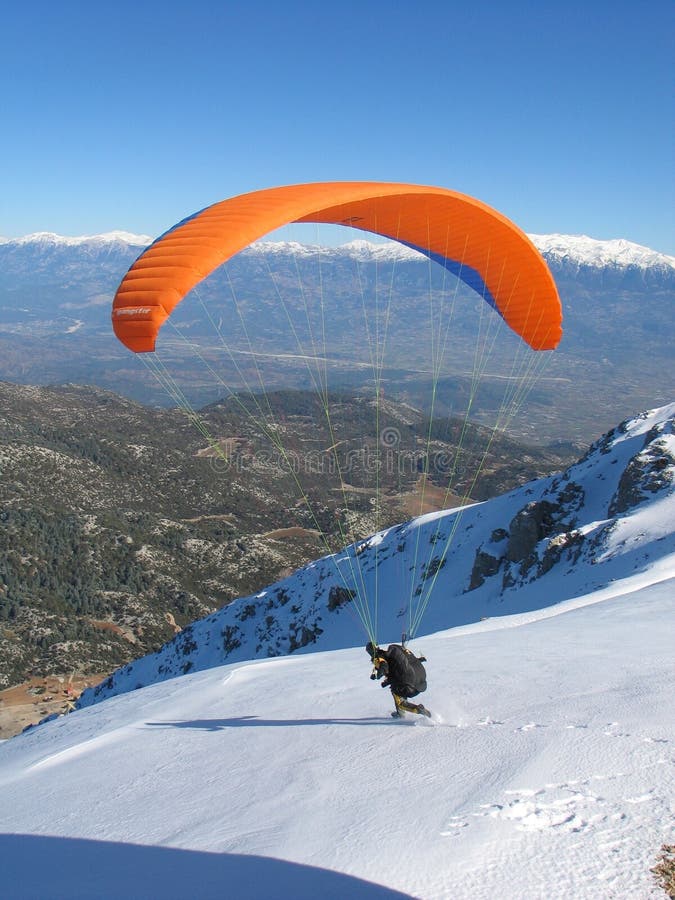 Paraglider snow launch stock image. Image of blue, orange - 12417731
