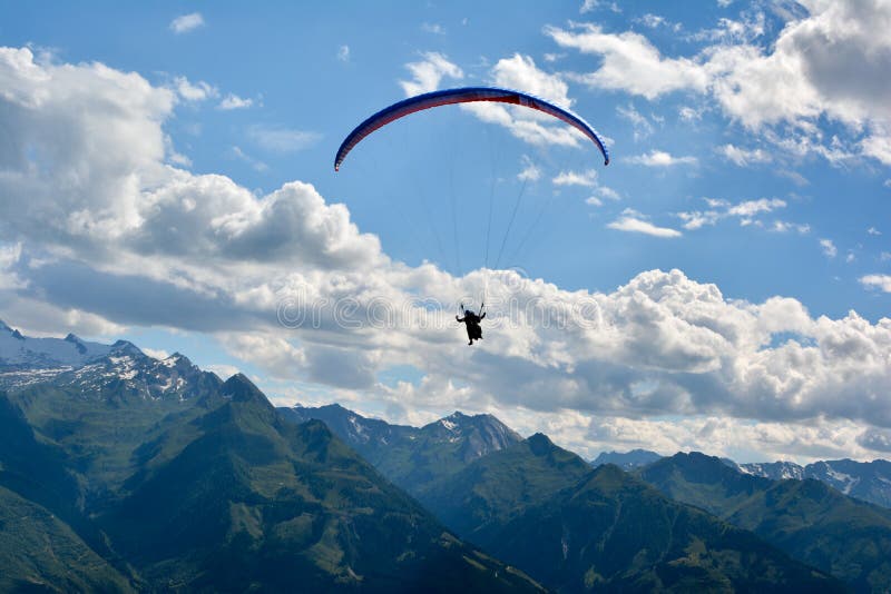 Paragliding in the alps stock photo. Image of hangglide - 43178466