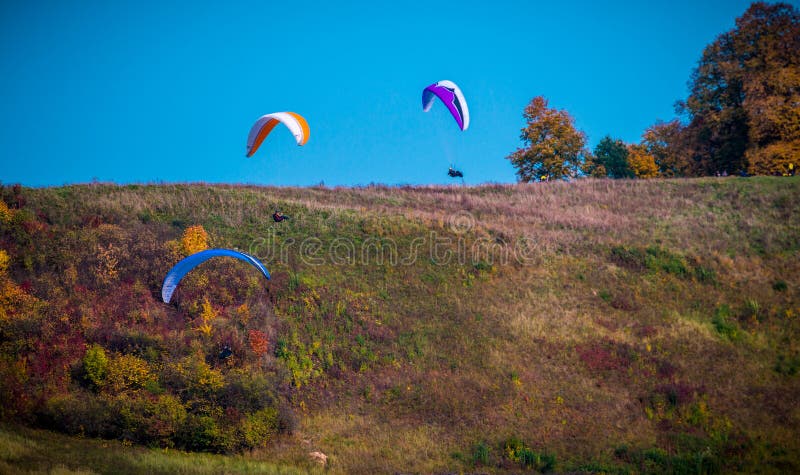 Paragliding in fall nature stock photo. Image of paraplane - 78308532