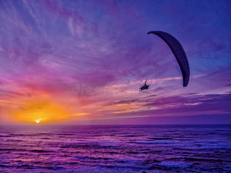 Paragliding Flight at Sunset Stock Photo - Image of horizon ...