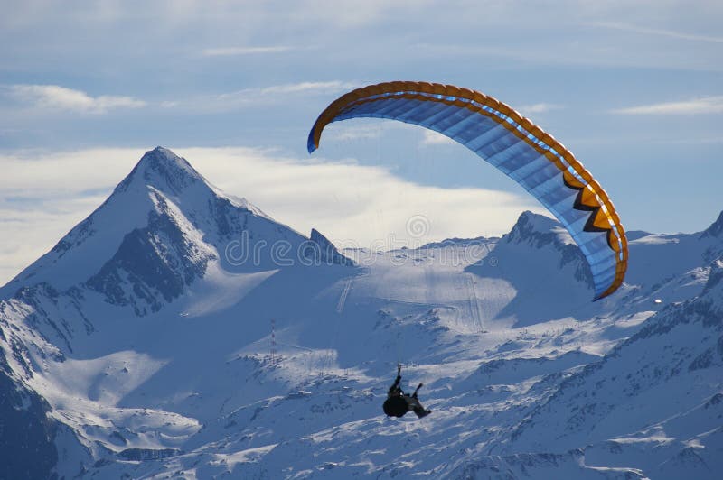 Winter Paragliding Over Mountain Peaks Stock Photo - Image of lift ...