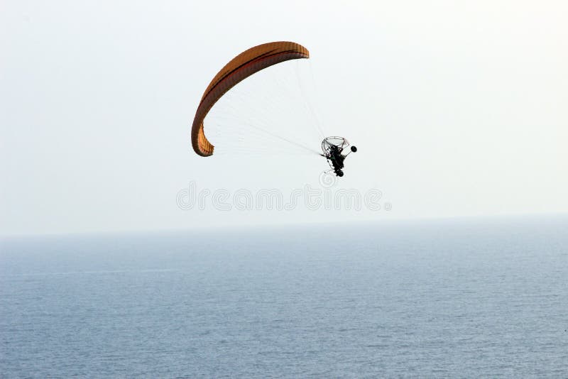 Paragliding over the ocean stock image. Image of natural - 119442989