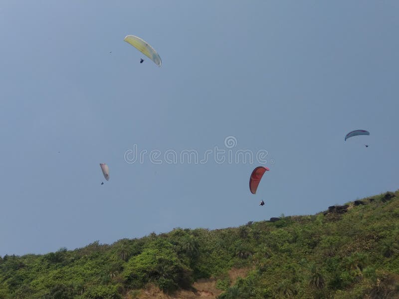 Paragliding in the sky Goa editorial photo. Image of paragliding ...