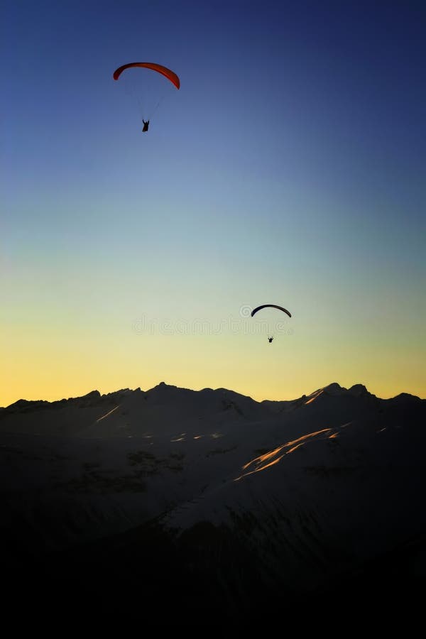 Paragliding into the Sunset Stock Image - Image of extreme, paragliding ...
