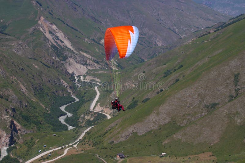 Paragliding Flight in the Mountains Stock Photo - Image of adrenaline ...