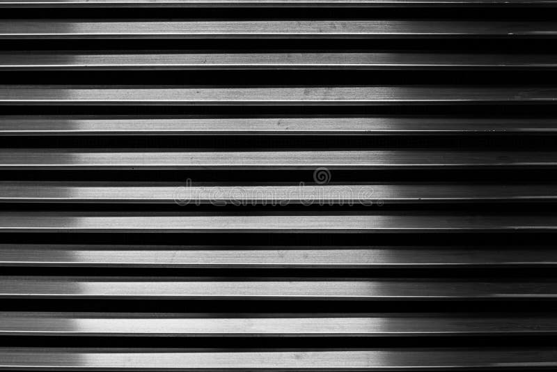 The Parallel Metal Bars of the Ventilation Grille Create a Repeating ...