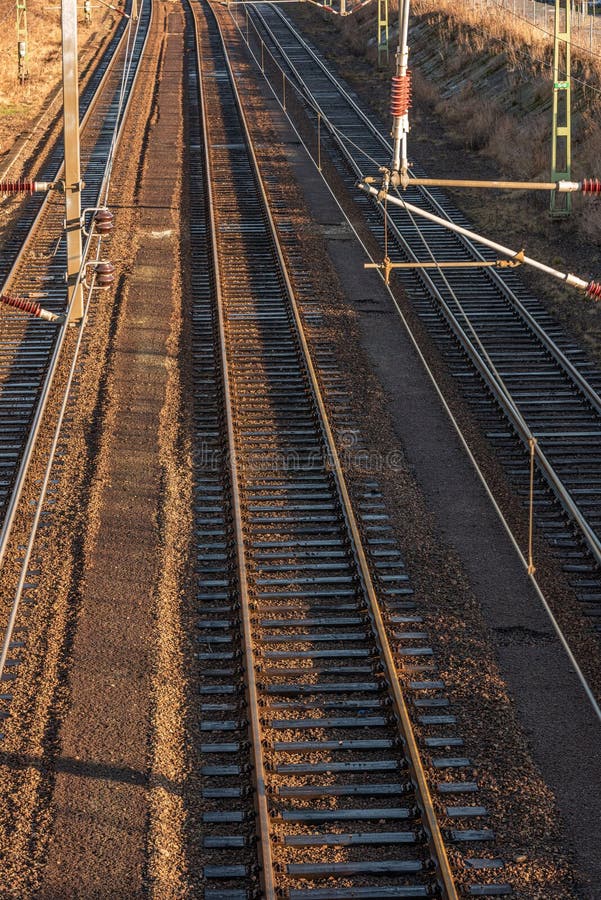 Parallel Railway Tracks and Power Lines in Low Sunlight. Stock Photo ...