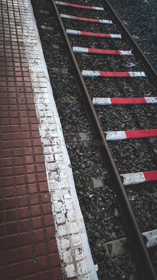 Two Parallel Tracks of a Railroad Line Next To Trees and Catenary Poles ...
