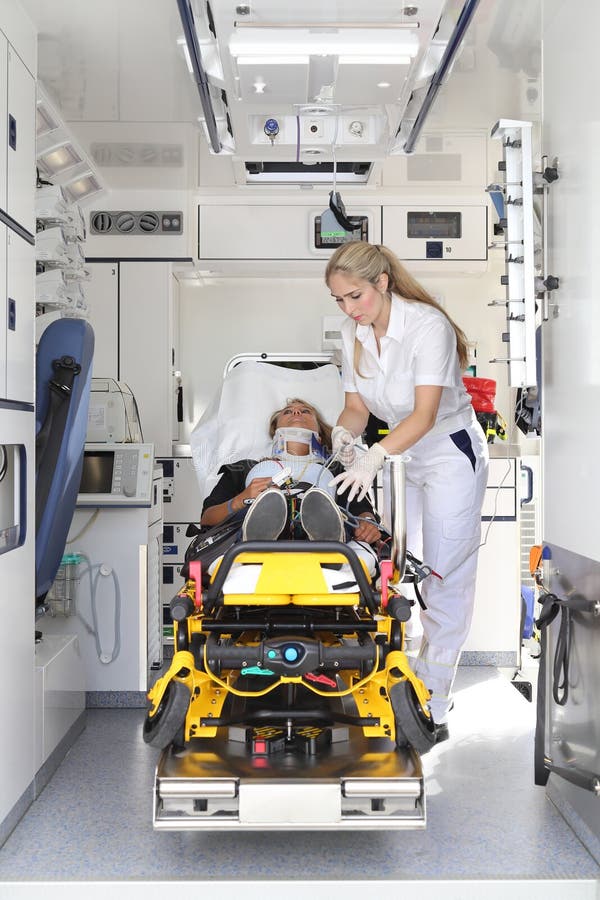 Paramedic in a Ambulance Car Giving First Aid Stock Image - Image of ...