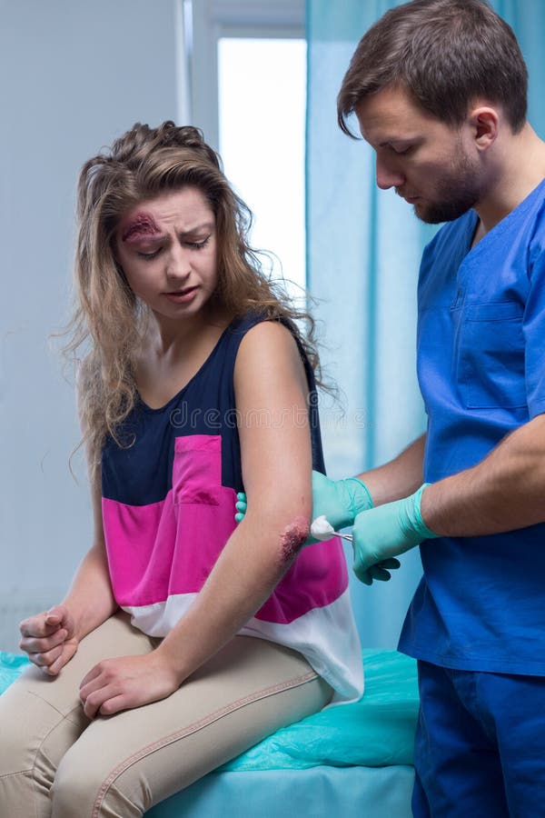 Paramedic Cleaning the Wound Stock Image - Image of paramedic, applying ...