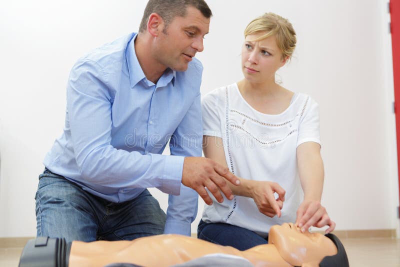 Paramedic Doing Chest Compression during Defibrillator Cpr Training ...