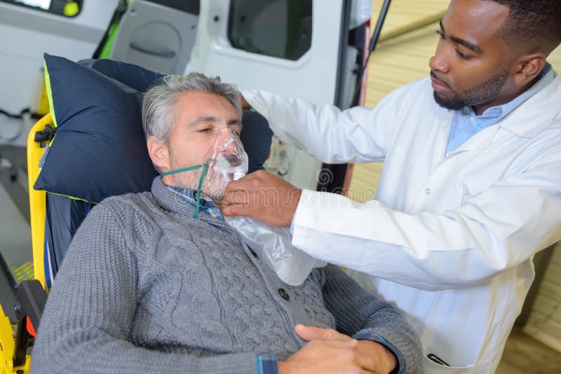 Giving oxygen to patient stock image. Image of clinic - 174515189