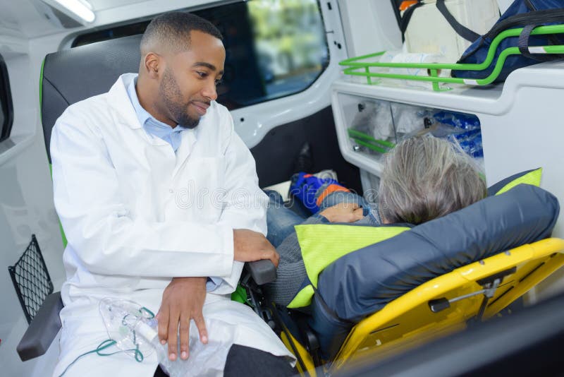 Paramedic Sat with Patient in Back Ambulance Stock Image - Image of ...