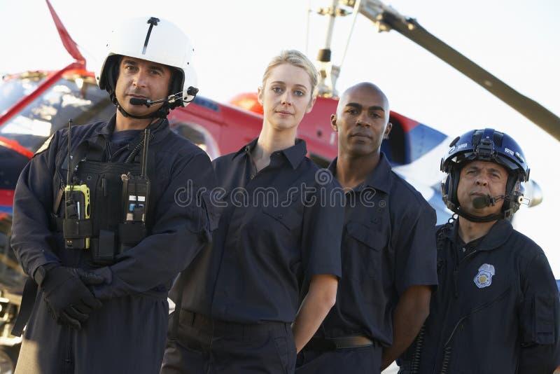 Paramedics and Crew in Front of Helicopter Stock Image - Image of pilot ...