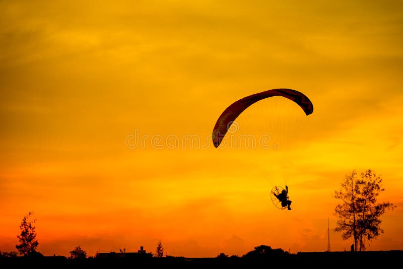 Paramotor Flying Silhouette Stock Photo - Image of skydiving, sunlight ...