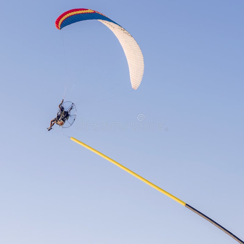 Paramotor Pilot Makes Acrobatics with a Banner Attached To the Foot ...