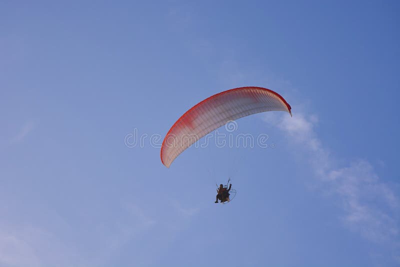 Paramotor Powered Paraglider with Red-White Parachute Flying in Sky ...