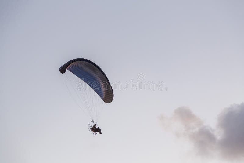 Paramotor in the sky stock image. Image of parachute - 123017529