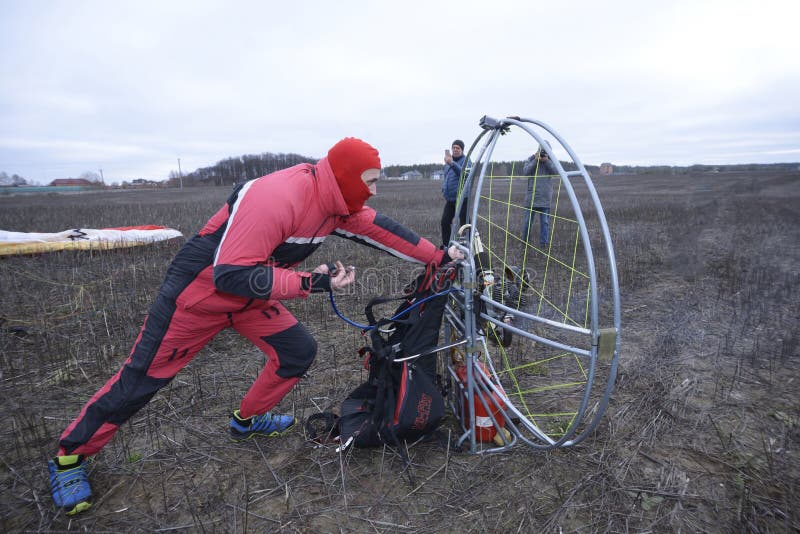 Paramotoring. Paramotorist Checking Rigging for Start To Fly Editorial ...