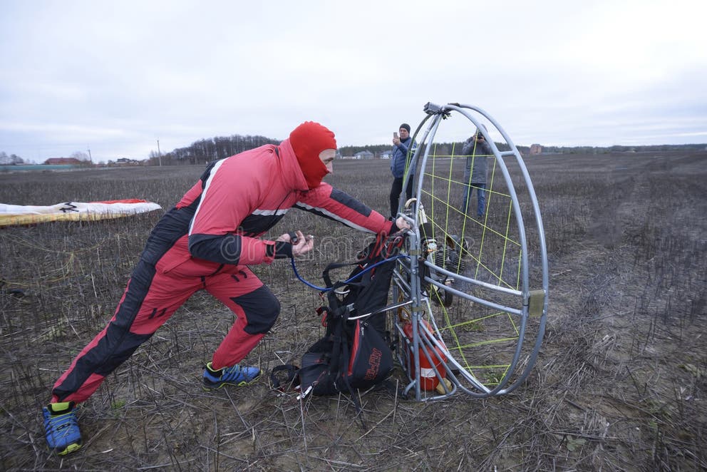Paramotoring. Paramotorist Checking Rigging for Start To Fly Editorial ...
