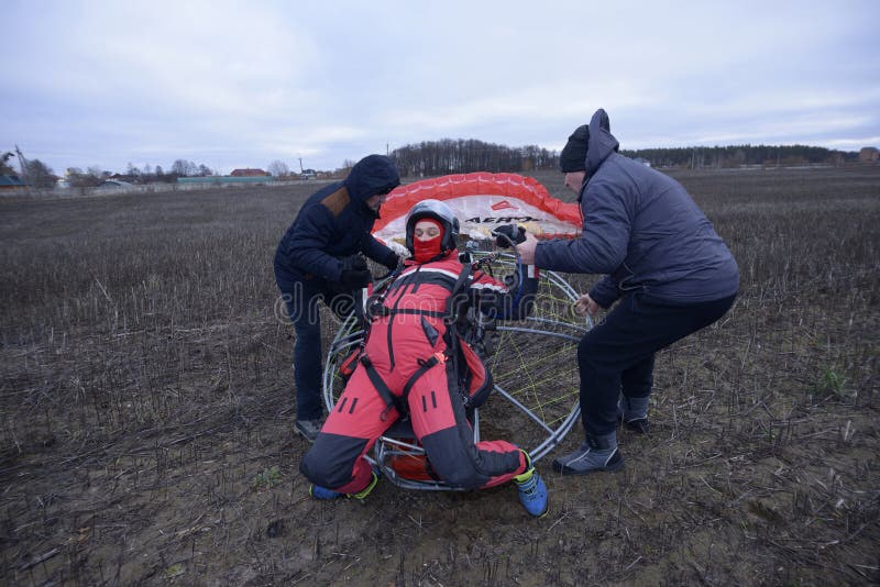 Paramotoring. Paramotorist Men Checking Equipment of Paramotor for ...